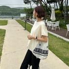 Lemite - Embroidery-Back Stopper-Hem Top | YesStyle