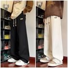 POSI - Mid Rise Lettering Logo Wide Leg Pants | YesStyle