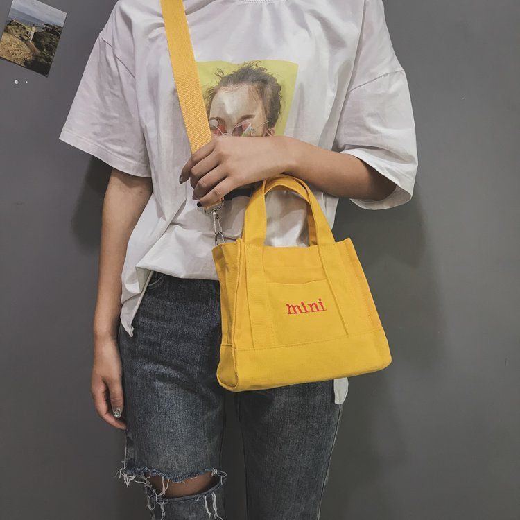 Youme Lettering Canvas Hand Bag | YesStyle